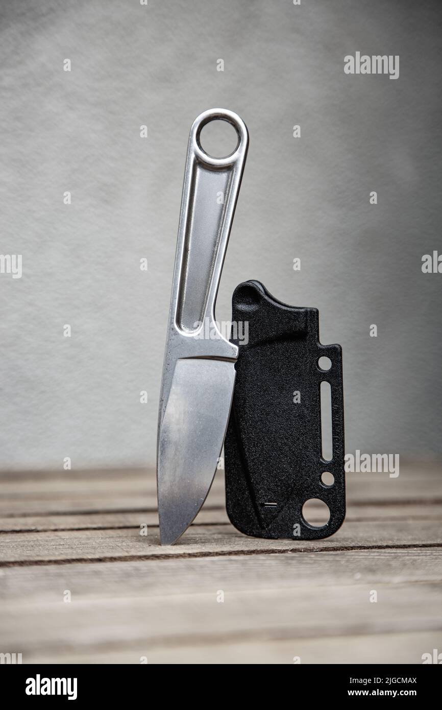 A knife with a metal handle made from a wrench. A tool weapon is stuck ...