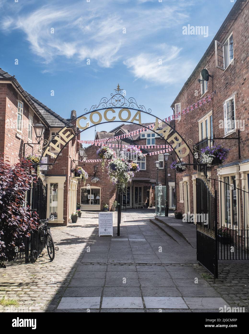 Nantwich Town Centre metal arch shopping area portrait sunny day ...