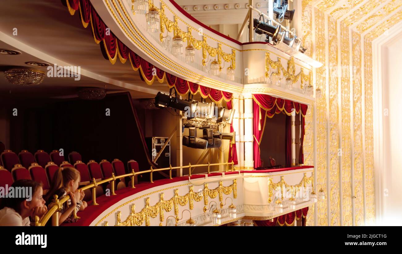 Beautiful classic interior of balcony with golden stucco in the theater ...