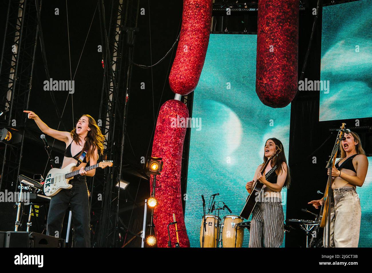 Alana, Danielle and Este Haim of the band Haim perform on stage at ...