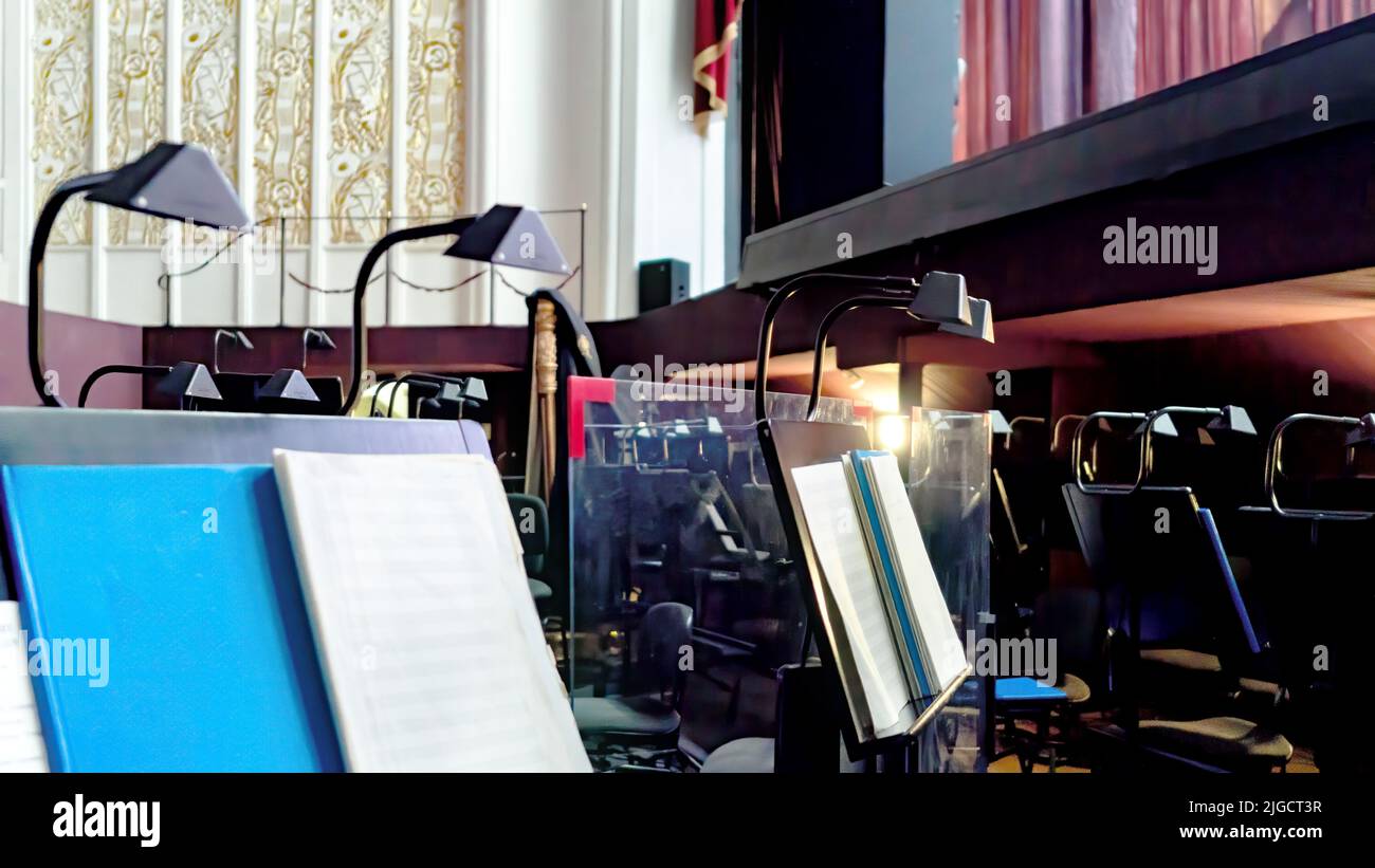 Notes on the music stand. Arrangement of an orchestra pit in the opera ...