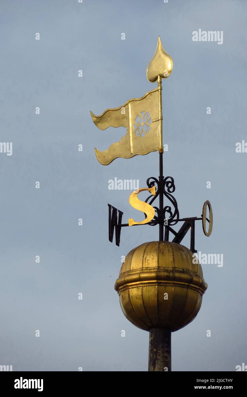 Old iron gold weather vane with flag on top Stock Photo - Alamy