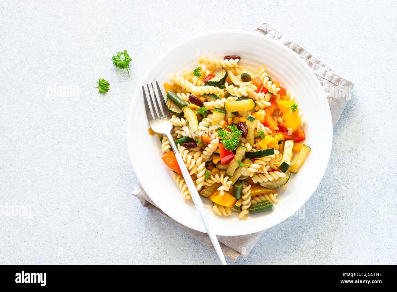 Vegan pasta fusilli with vegetables, zucchini, paprika and grean beans ...