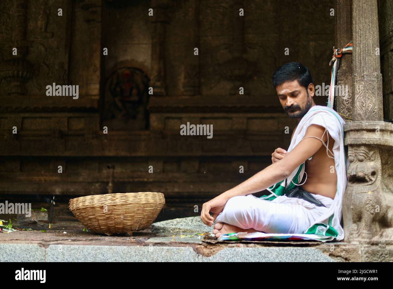A selective focus of a hindu priest in pure hindu attire at Virupaksha ...
