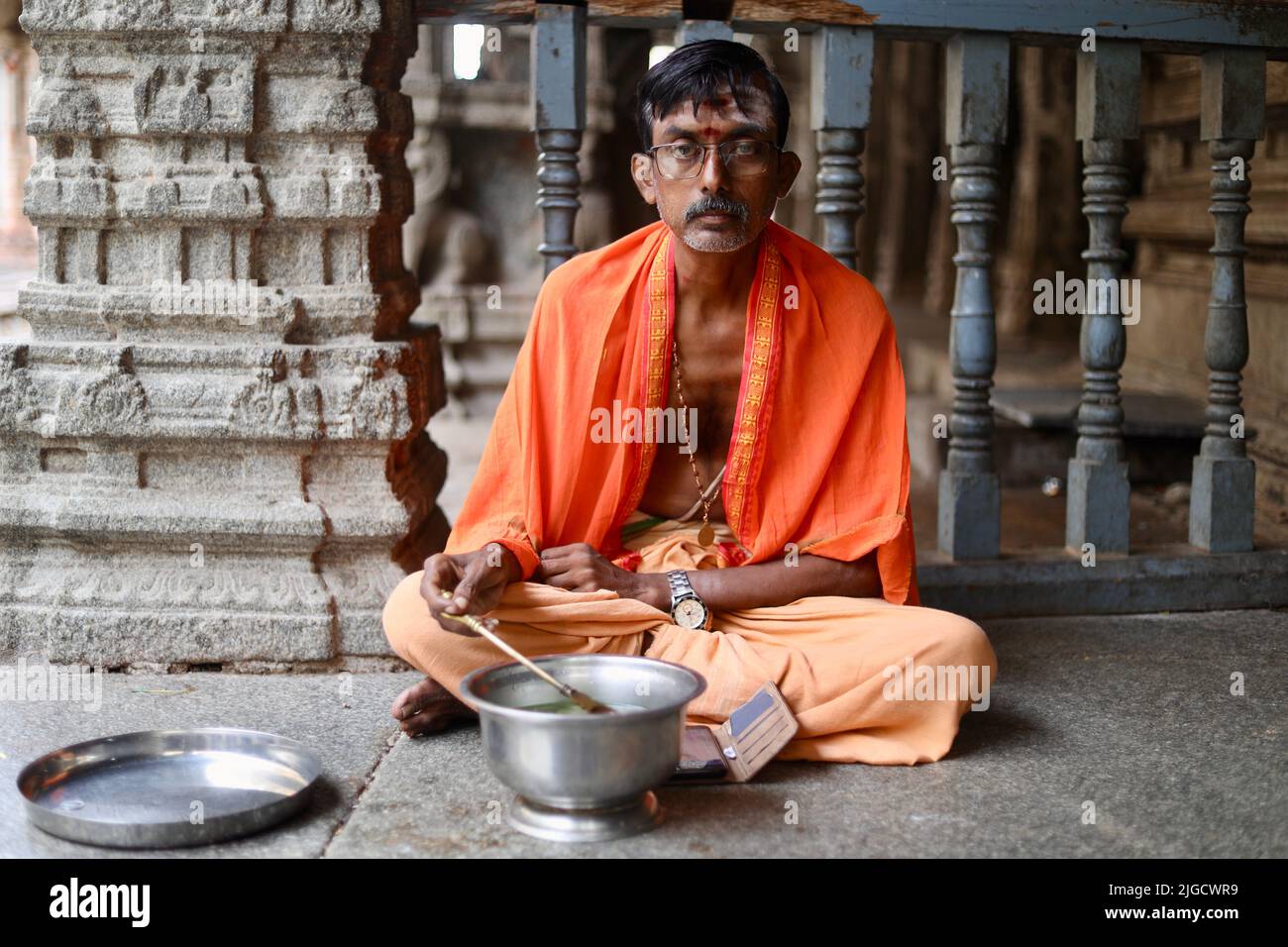 A selective focus of a hindu priest in pure hindu attire at Virupaksha ...