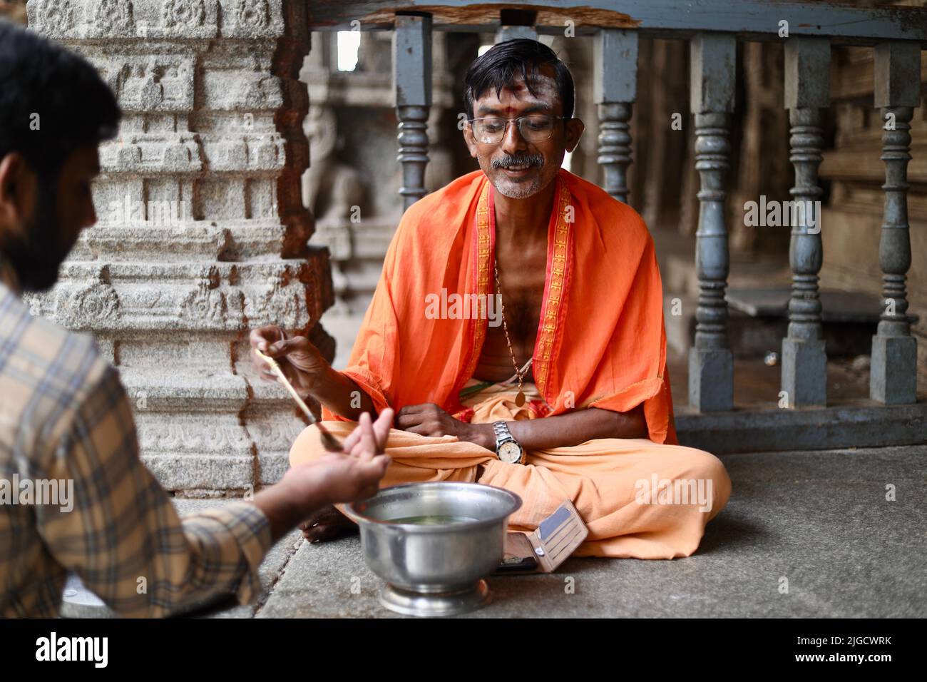 A selective focus of a hindu priest in pure hindu attire at Virupaksha ...