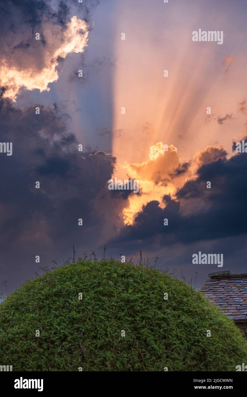 Golden rays coming out of the clouds over Annapurna Mountain Range ...