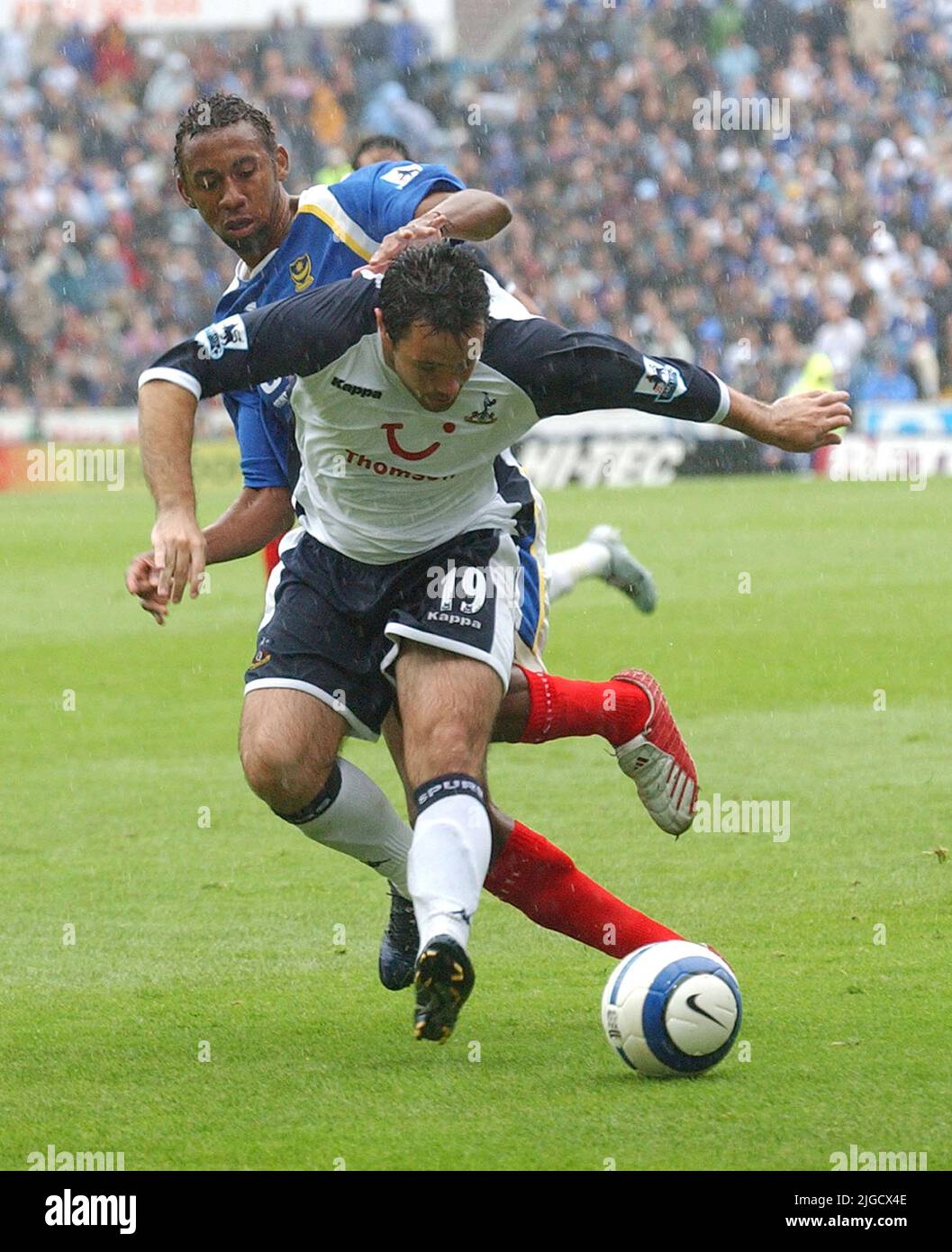 Portsmouth v Spurs John Viafara tackles Andy Reid. Pic MIKE WALKER 2005 ...