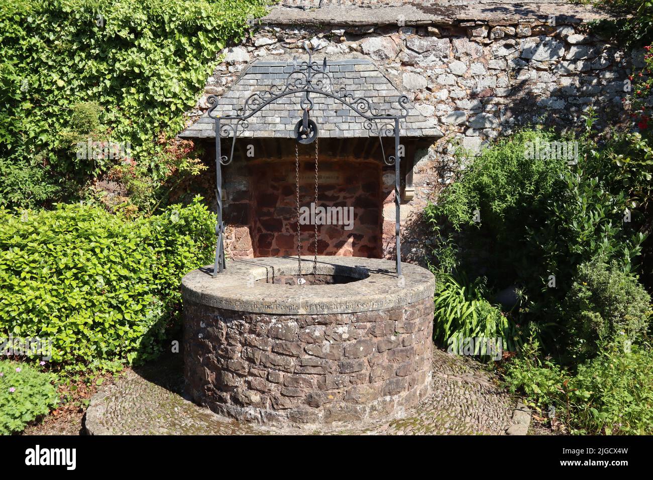 A commemorative well built from natural stone and ornate iron work in ...