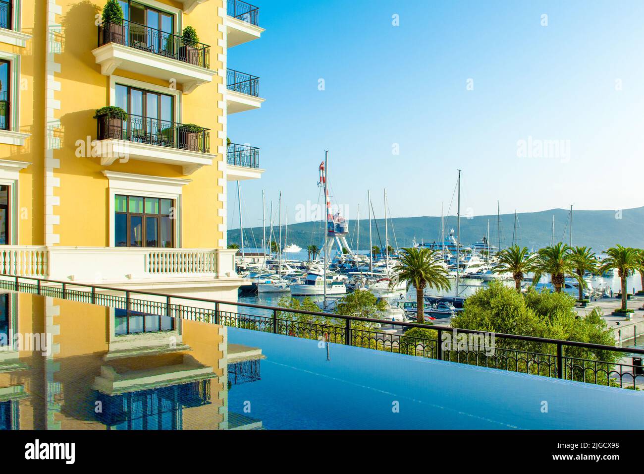 Tivat, Montenegro - June 18, 2022: View from infinity pool to the yacht ...