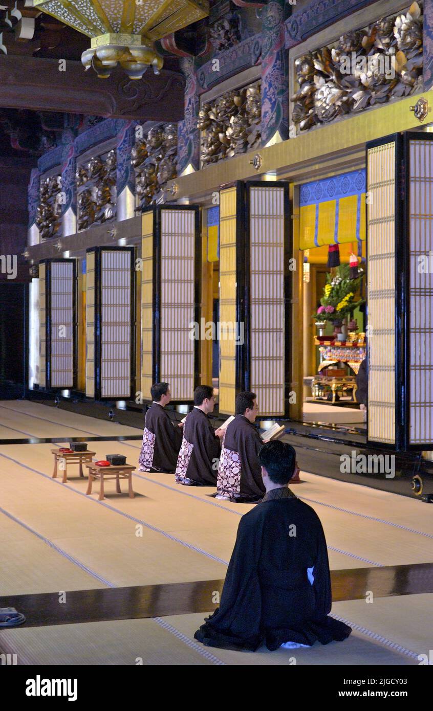 Buddhist Monks praying inside the Hongwan-ji Temple main hall, Kyoto JP ...
