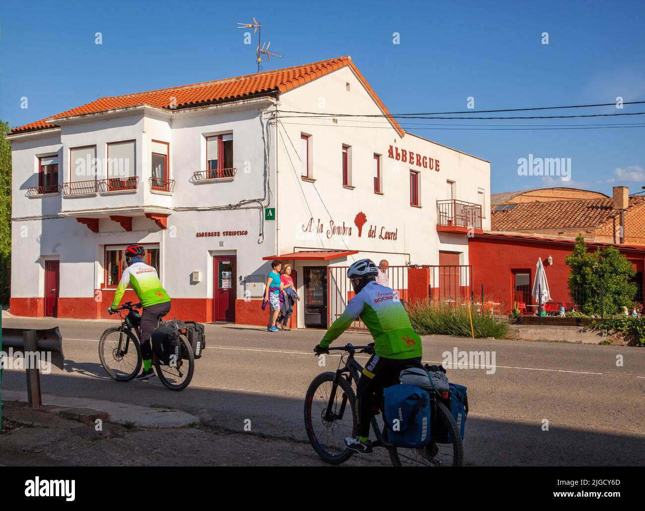 Pilgrims cycling through La Rioja at Navarrete while riding the Camino ...