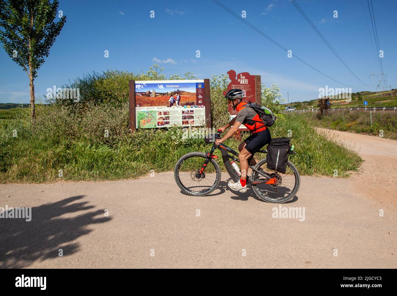 Pilgrims cycling through La Rioja near Ventosa while riding the Camino ...