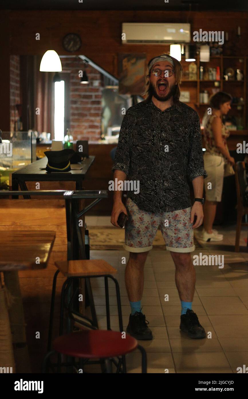 Members of the conversational club are seen in a classroom doing ...