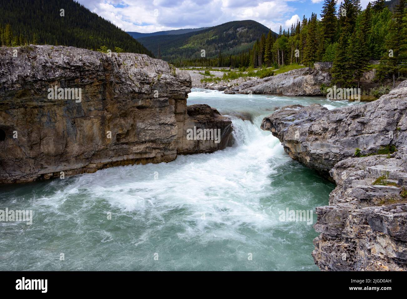 flowing river through rocky rapids Stock Photo - Alamy
