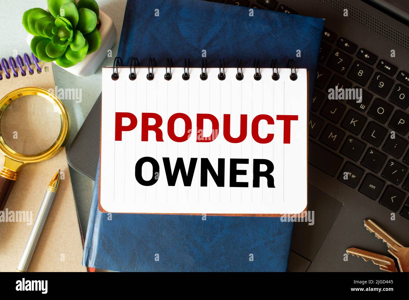 PRODUCT OWNER . Text written on the notepad with office tools and ...