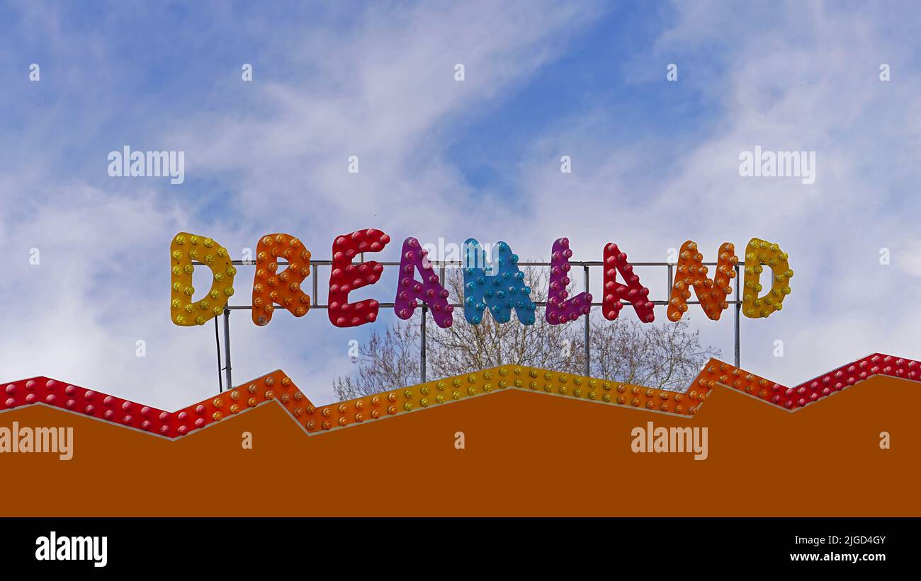 Color sign dream land led lamps at fun park sky Stock Photo - Alamy