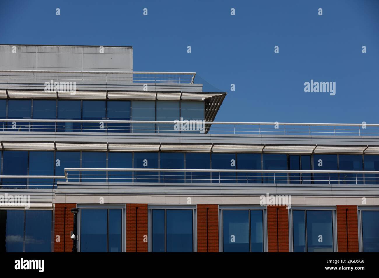 Detail of the roof and top floor of a modern building with horizontal ...