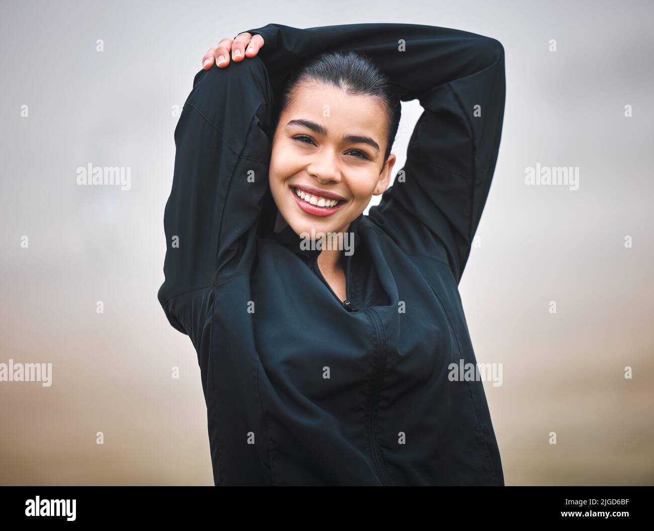 Going Through My Pregame Warmup Cropped Portrait Of An Attractive Young Female Athlete Warming