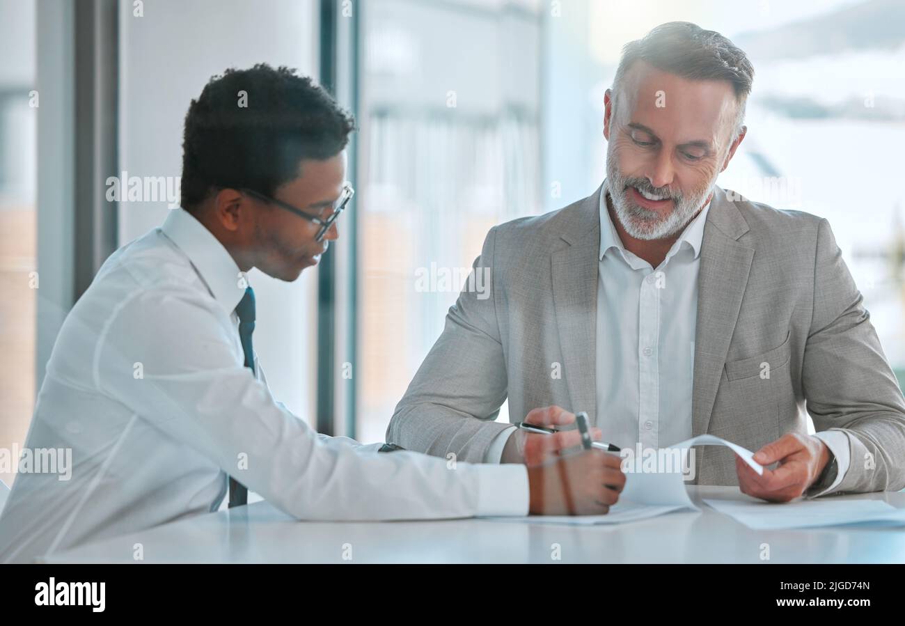 Two people signing business contract hi-res stock photography and ...