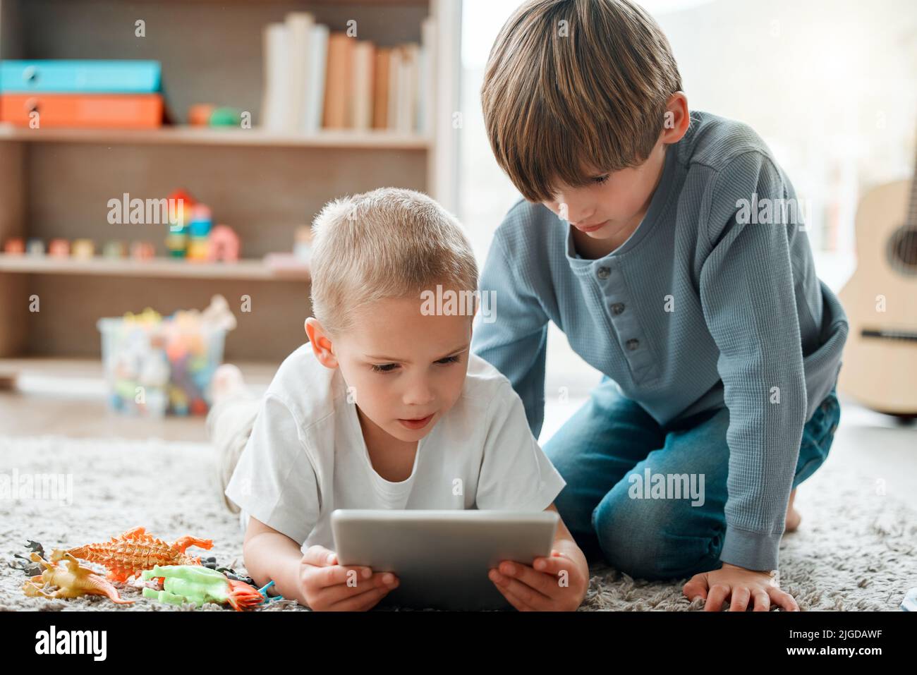 The most important thing in the world is family. two brothers using a ...