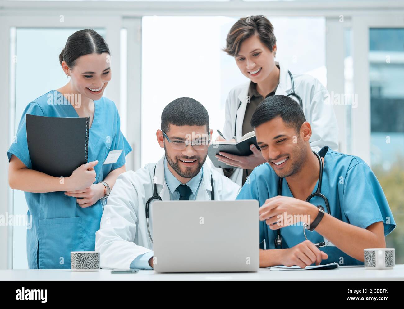 Using technology to improve the medical field. a group of doctors using ...