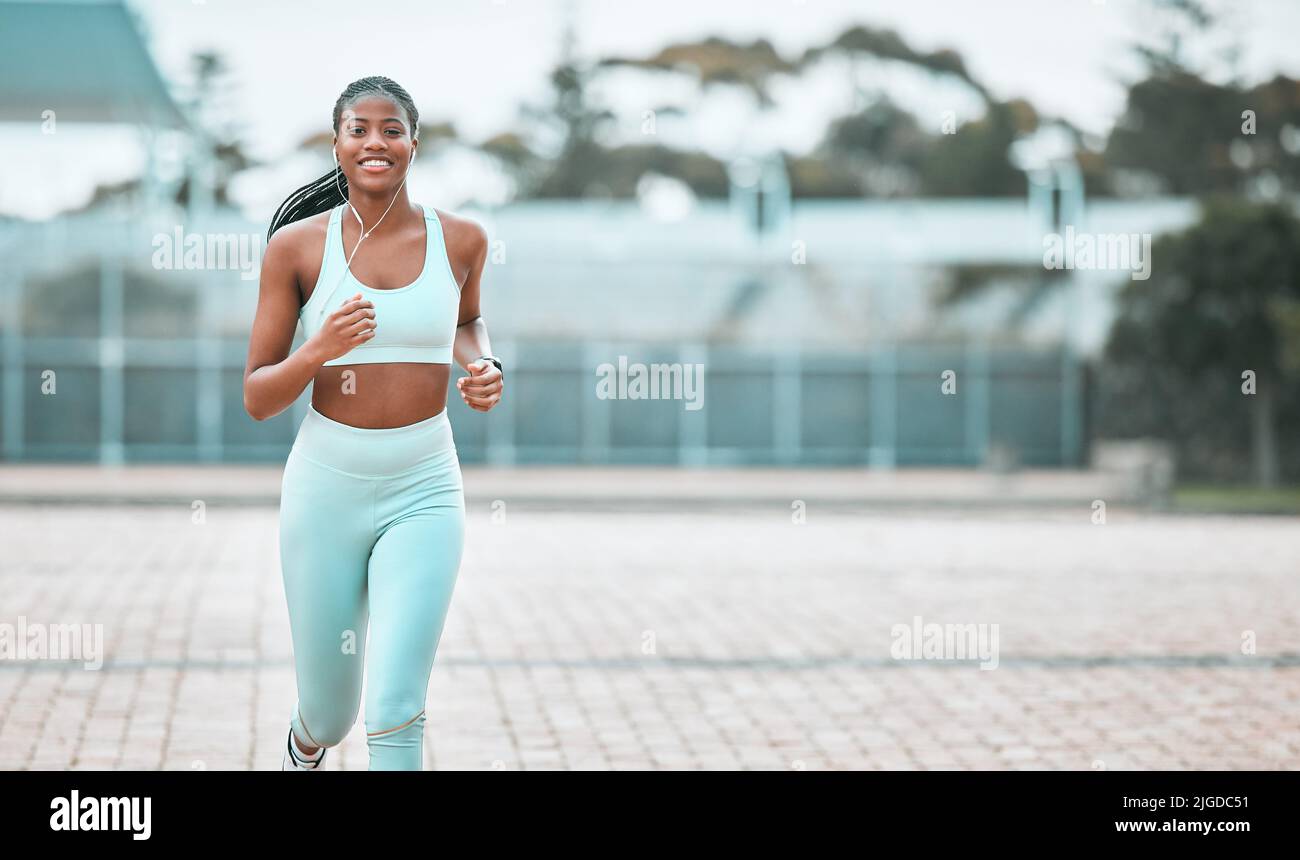 The road is my best friend. a young woman running outside Stock Photo ...