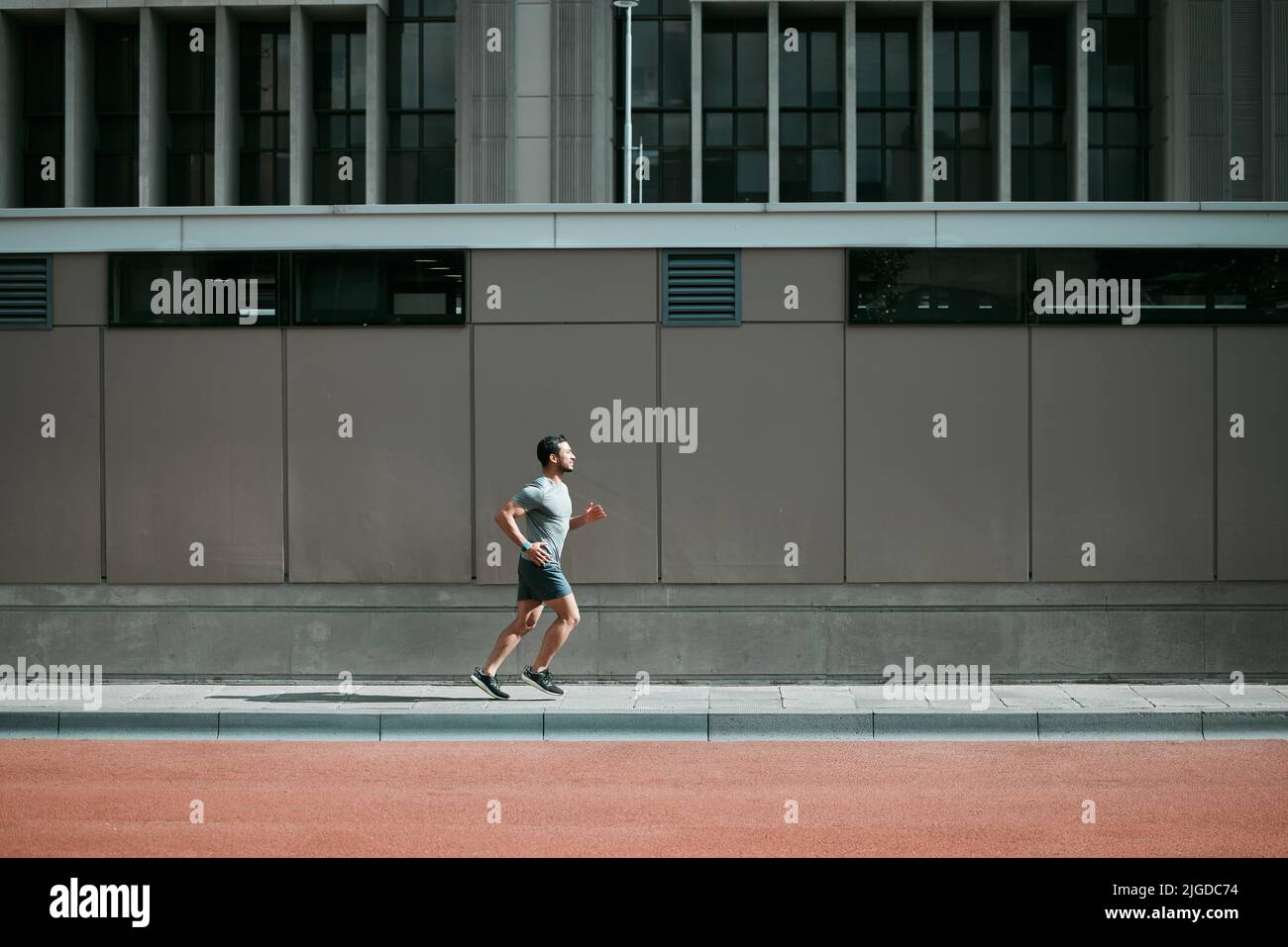 Ready to the hit pavement. a young man going for a morning run Stock ...