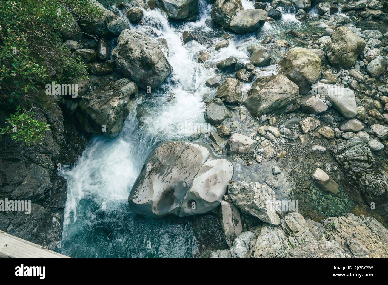 Small waterfall tumbling and splashing down in Bealey river in Southern Alps Stock Photo - Alamy