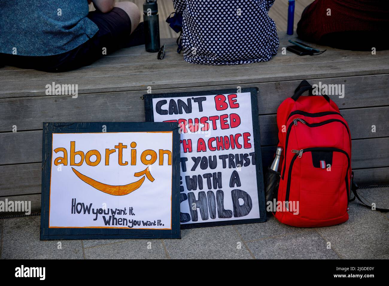 London, UK. 09th July, 2022. Protesters hold placards expressing their ...
