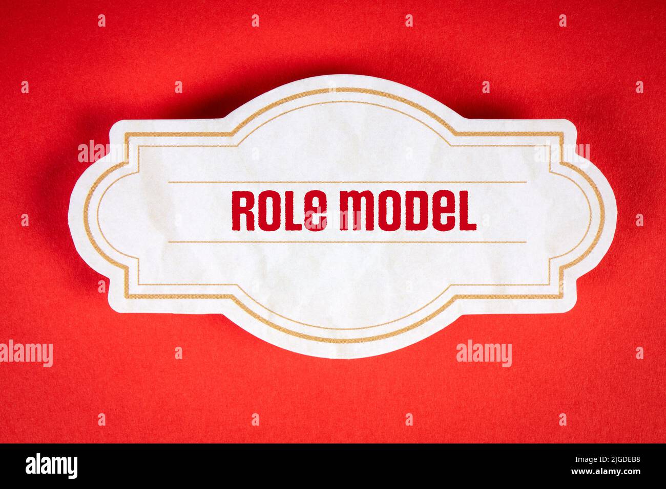 Role Model. Text on a decorative label sheet. Red background Stock ...