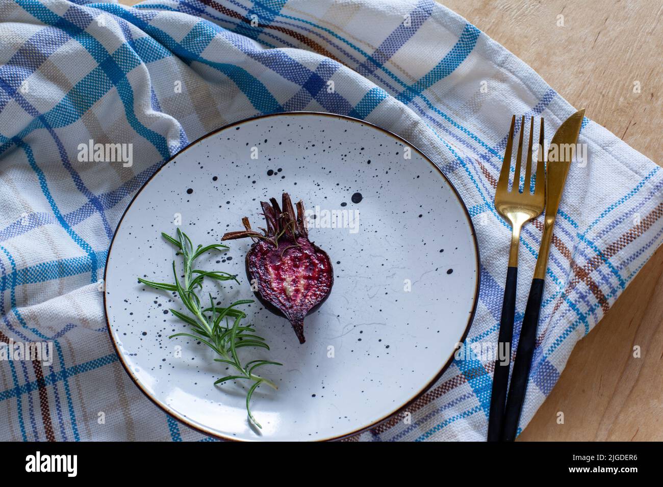 Roasted young half beet with rosemary and sea salt Stock Photo - Alamy