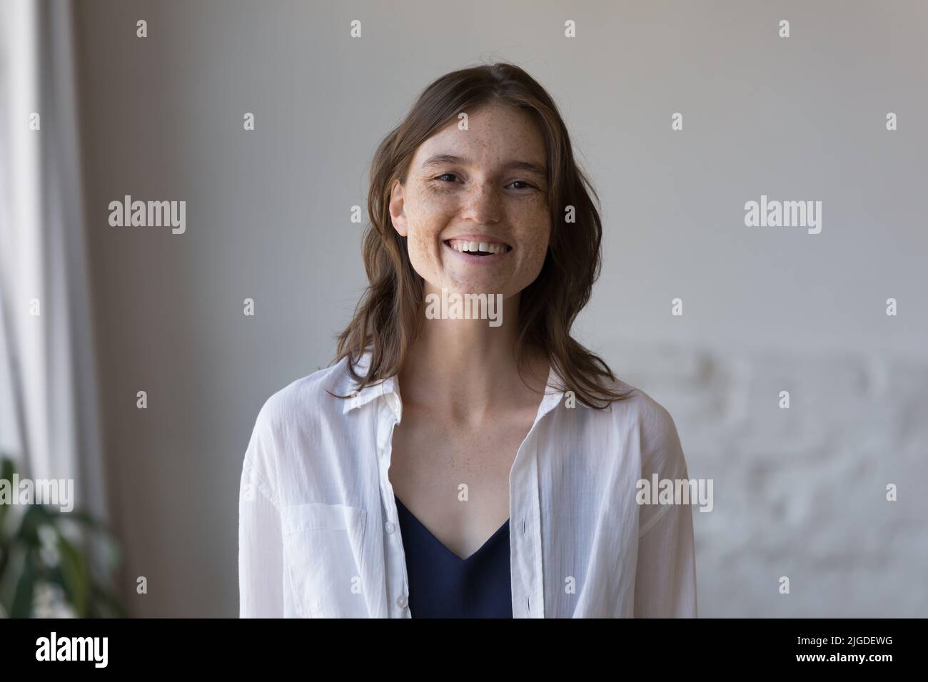 Woman with nice freckles on face smile staring at camera Stock Photo ...