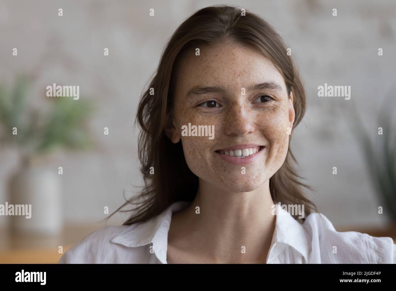 Young woman with nice freckles on non-make-up skin Stock Photo - Alamy