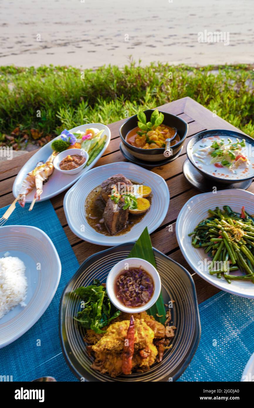 Thai food on a table on the beach in Thailand. table with Thai food ...