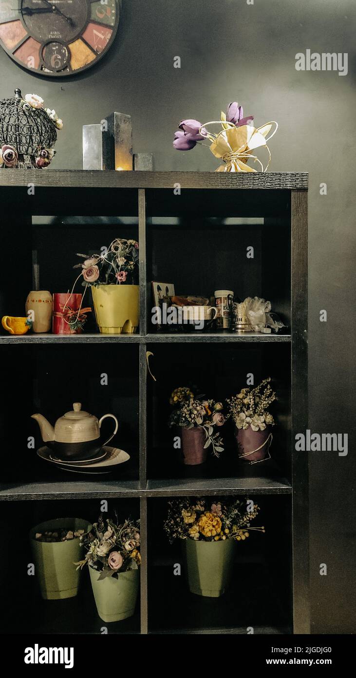 An interior design concept beautiful shelf against a dark wall Stock ...