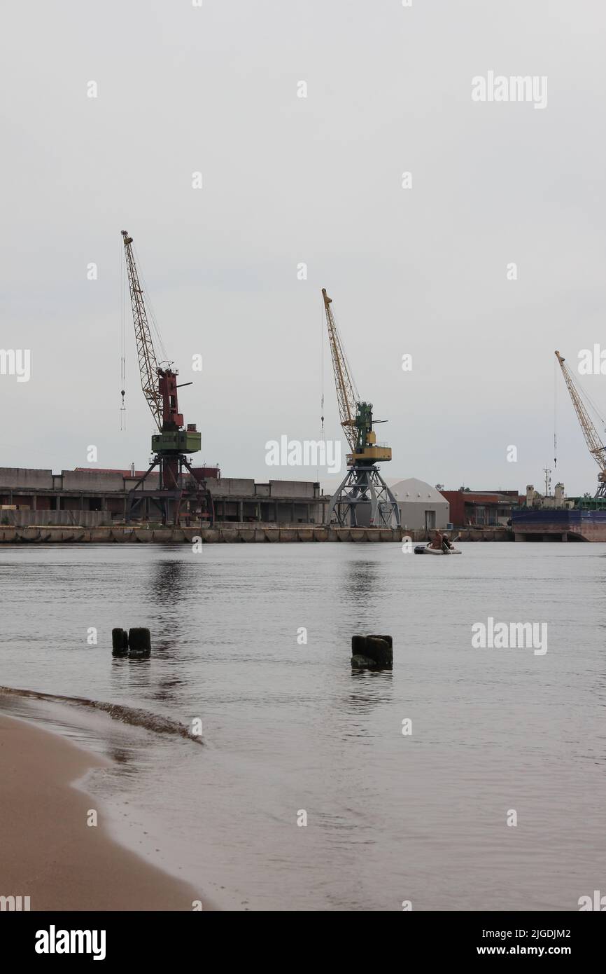 Port terminal. View at the deck cranes from ashore Stock Photo - Alamy
