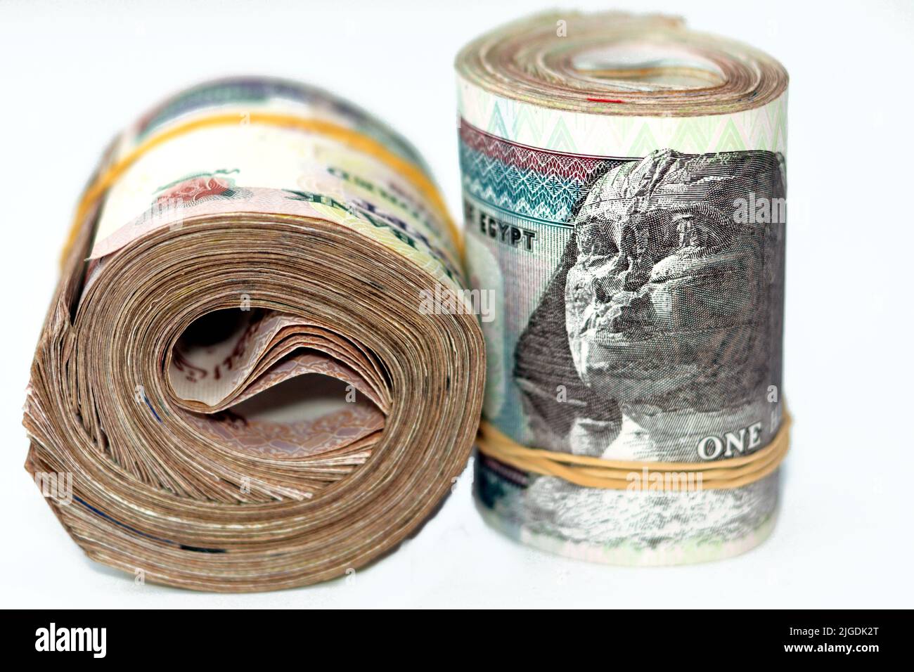 Egypt money roll pounds isolated on white background, 200 LE and 100 LE ...