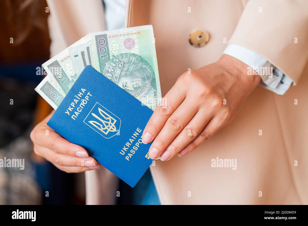 A Girl Holds In Her Hands A Ukrainian Biometric Passport With Poland