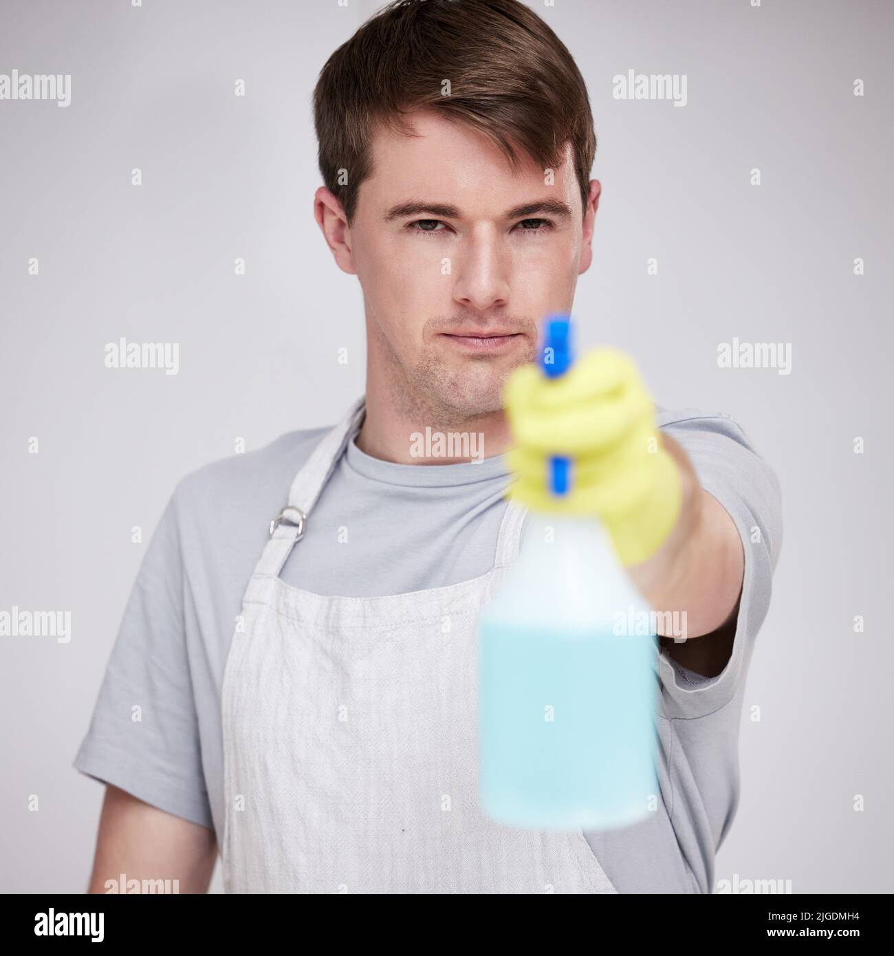 Well spray all the dirt away. a young man holding a spray bottle ...
