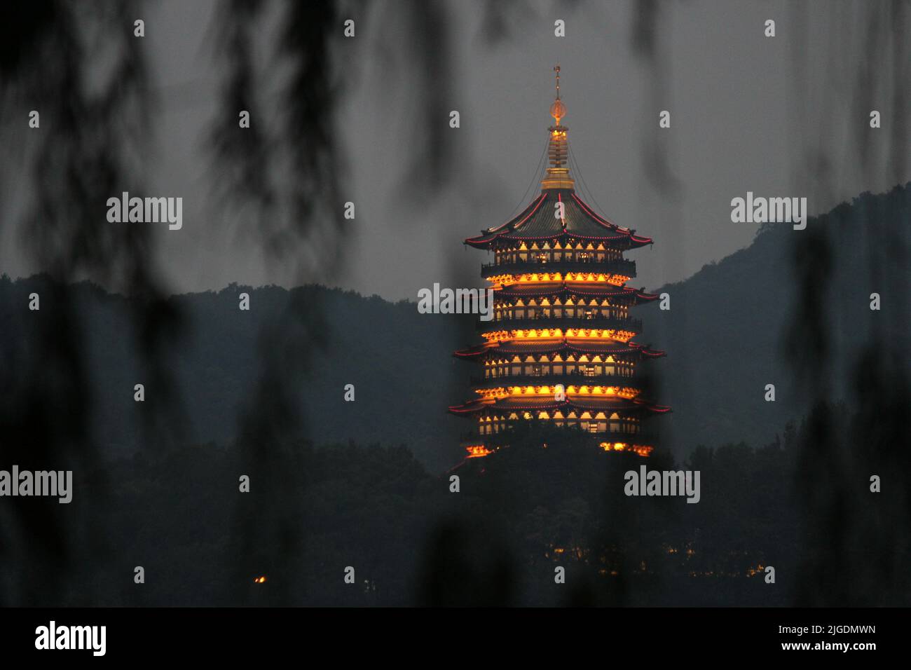 A distant view of Leifeng Pagoda tower in the evening in Hangzhou ...