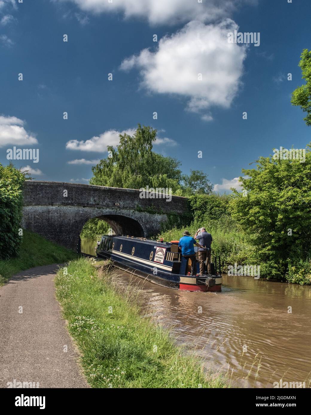 Nantwich Canal narrowboat approaching bridge portrait, Shropshire Union ...