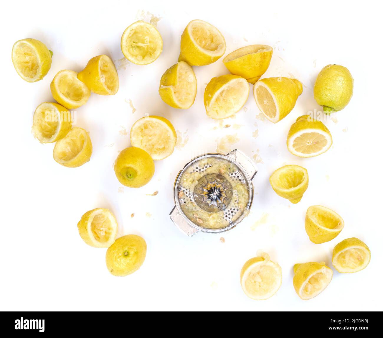 Squeezed lemons with citrus press Stock Photo - Alamy