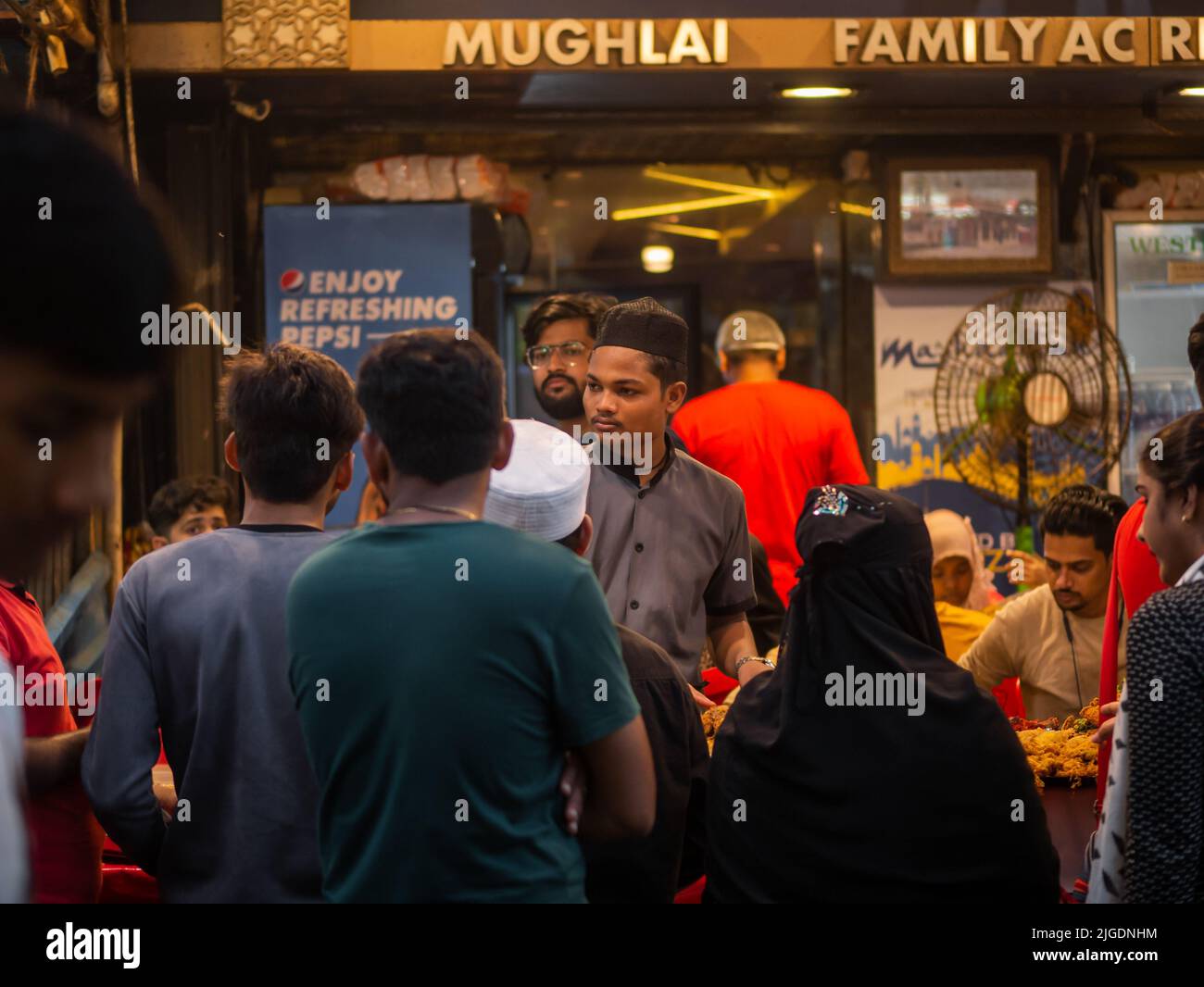 Mumbai, India - May 1, 2022 : Muslim male vendor cooking selling halal foods and Kababs from ...