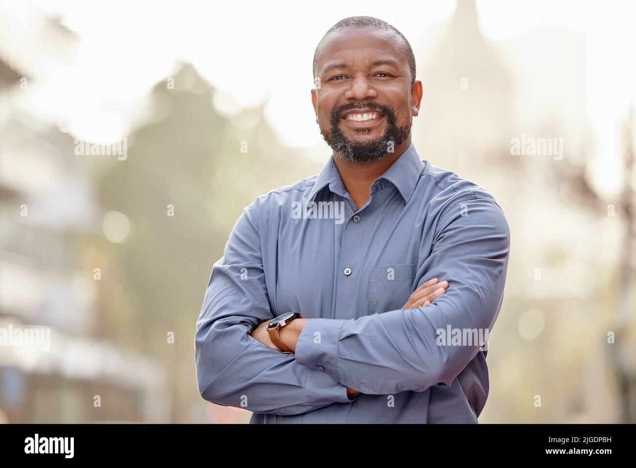 Taking matters into my own hands. a young businessman standing with ...