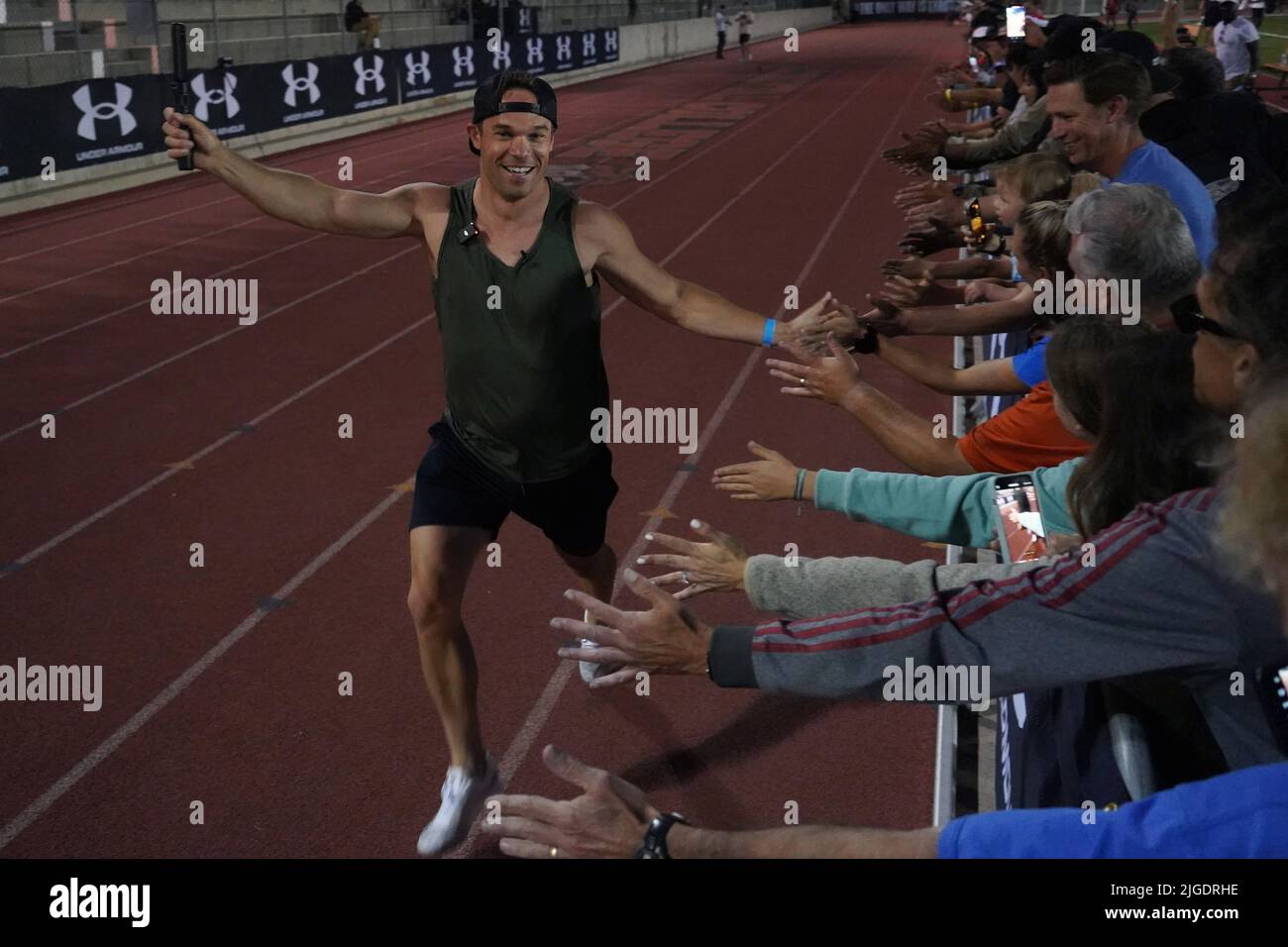 Nick Symmonds attempts a world record for most high fives in sixty ...
