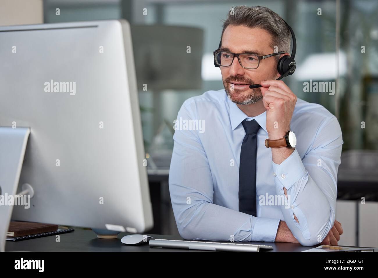 Your problem my priority. a mature male call center agent working in a ...