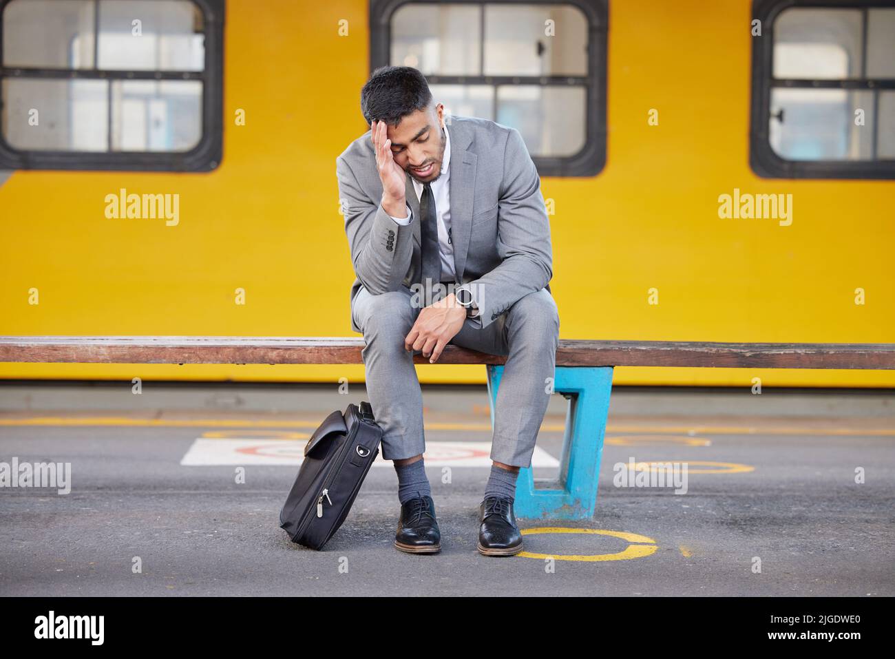 I have zero motivation for work today. a young businessman looking ...