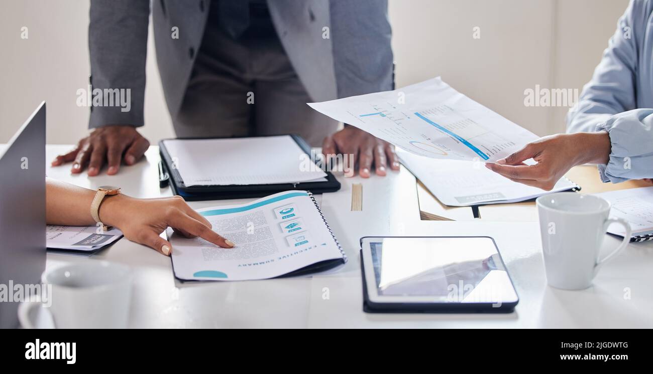 Lay it all out on the table. a group of businesspeople discussing ...