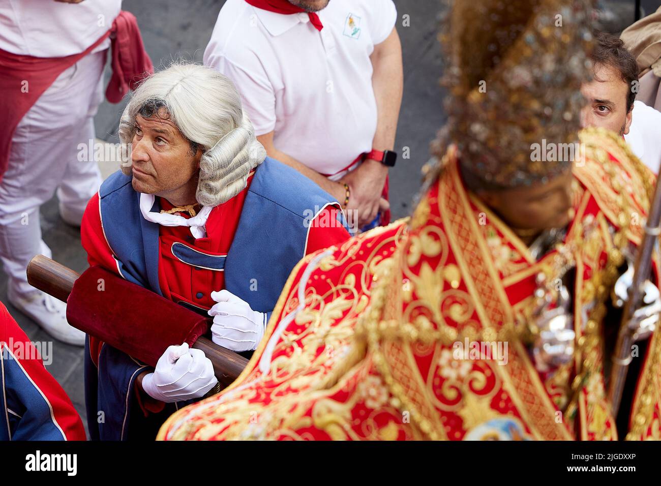 People attend the San Fermin procession during the traditional San ...